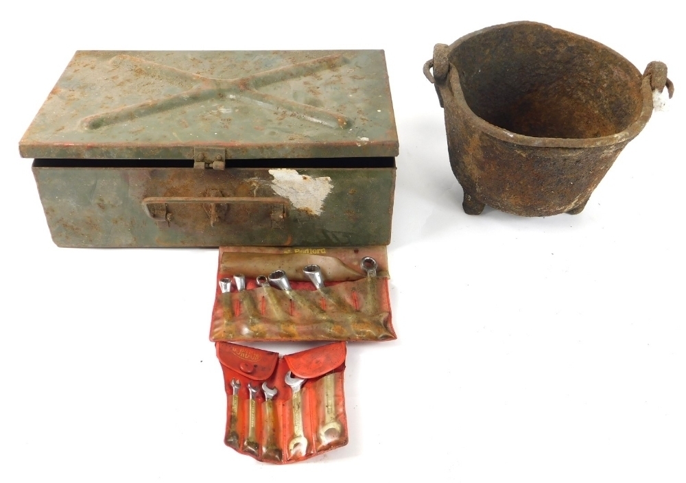 A small iron cauldron, with swing handle, and a tin boxed, possibly ...
