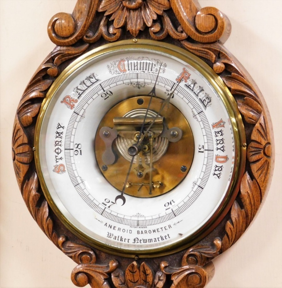A Victorian oak cased Walker of Newmarket aneroid wall barometer, with ...