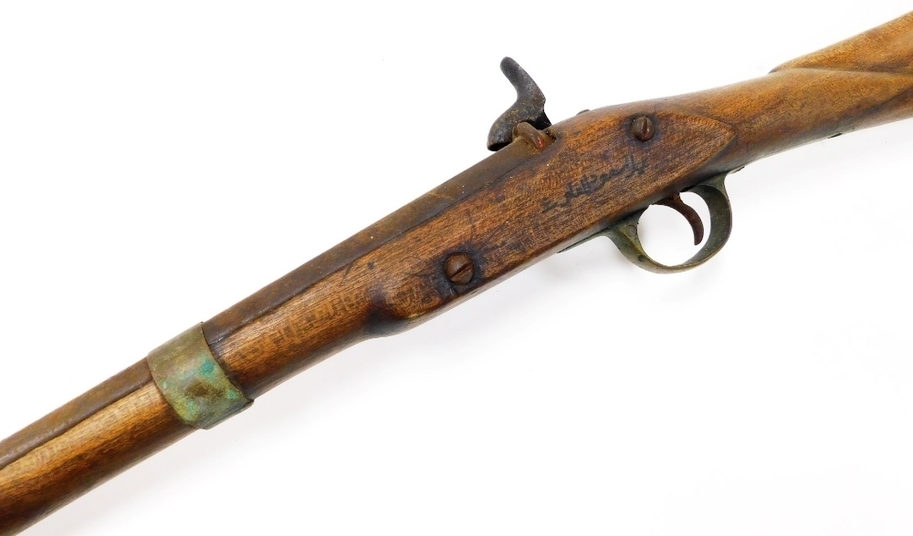 A Victorian Tower flint lock rifle, with an elm stock, the steel barrel ...