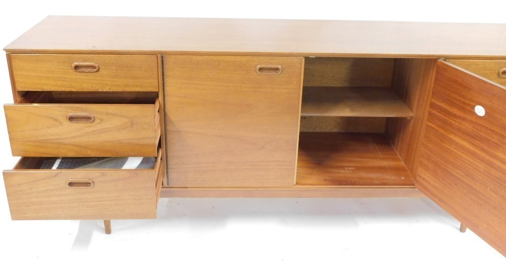 An Avalon Yatton retro teak sideboard, with arrangement of three ...