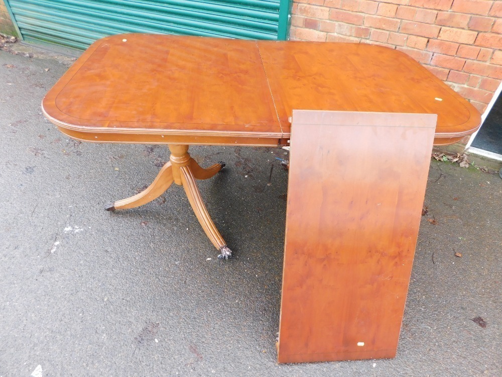 A reproduction twin pedestal dining table, with one additional leaf.