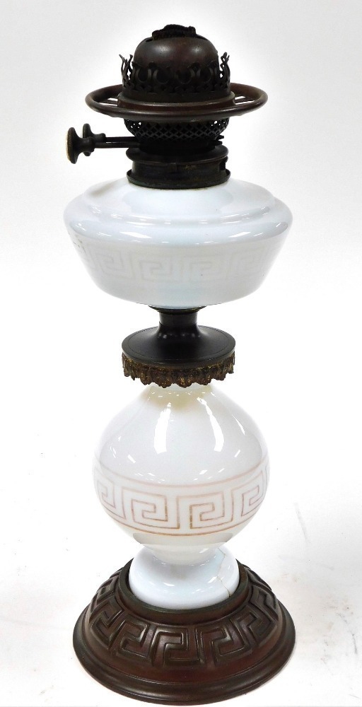 A Victorian milk glass and metal oil lamp, by James Hinks and Sons ...