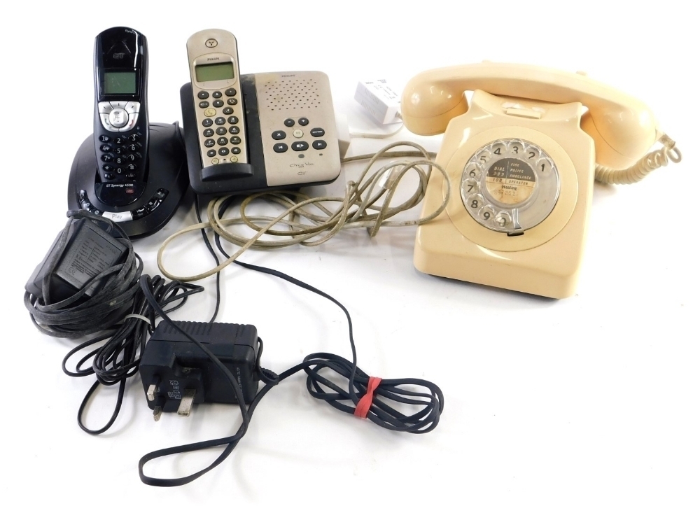 An ivory coloured plastic telephone, with front plastic articulated ...