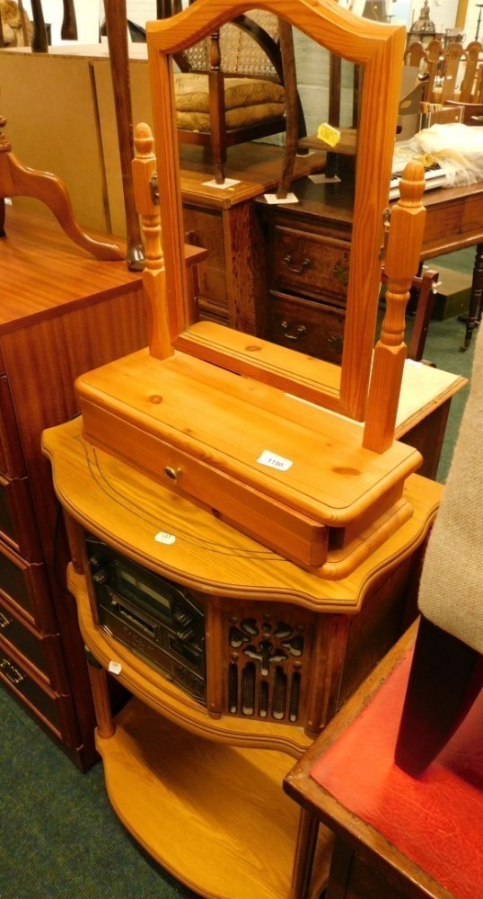A freestanding compact disc player in wooden cabinet, on stand with ...