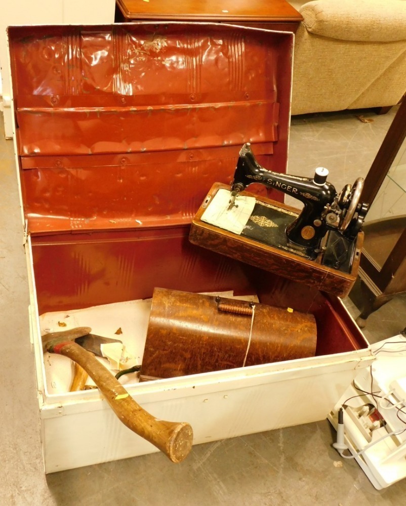 A cream painted tin trunk, various tools, sewing machine.
