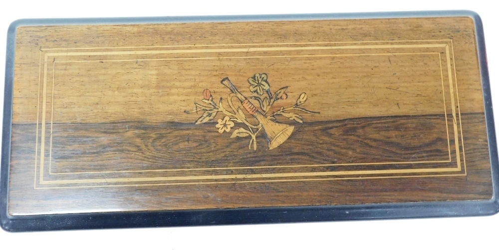 A late 19thC rosewood cased music box, playing eight airs, the hinged ...