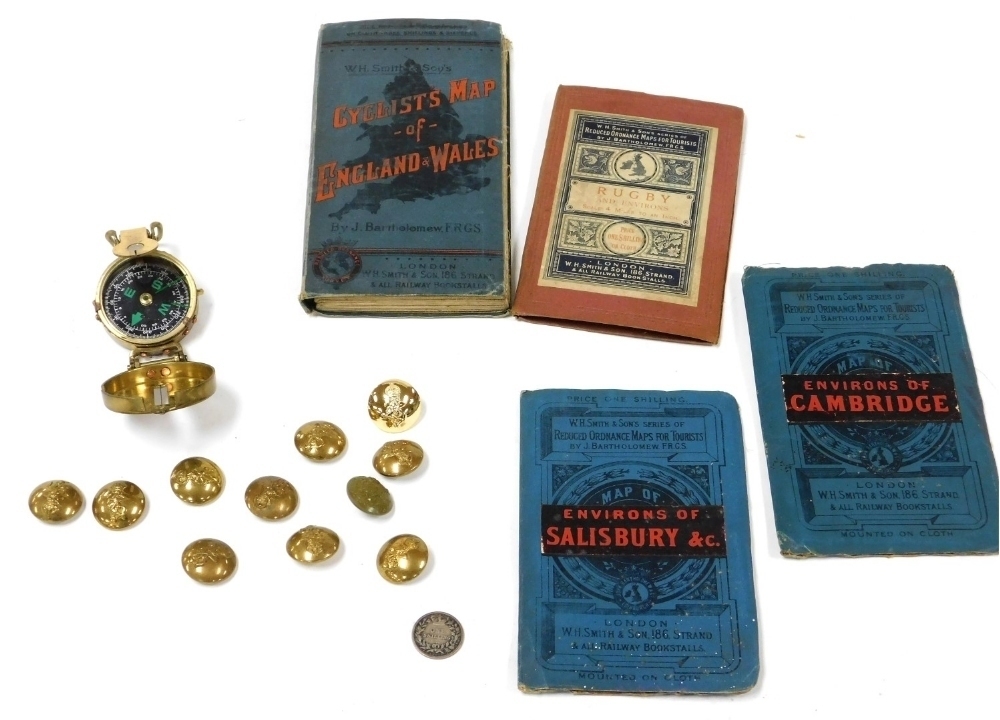 A military type brass pocket compass, military buttons, Bartholomew ...