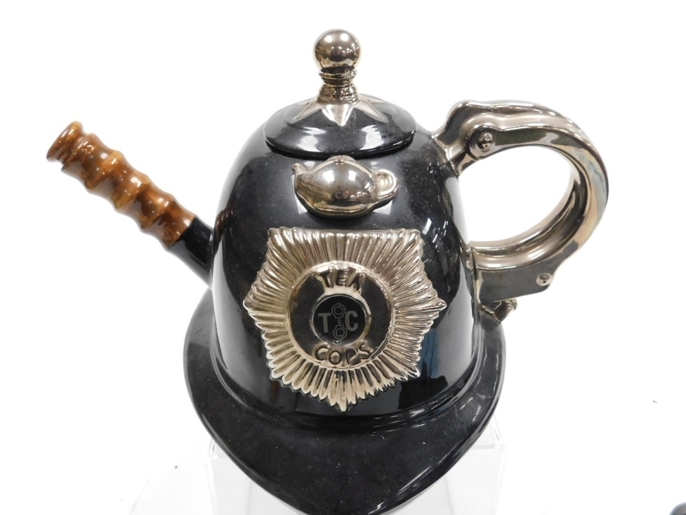 Five novelty pottery teapots, comprising a Saddlers type matt black car ...
