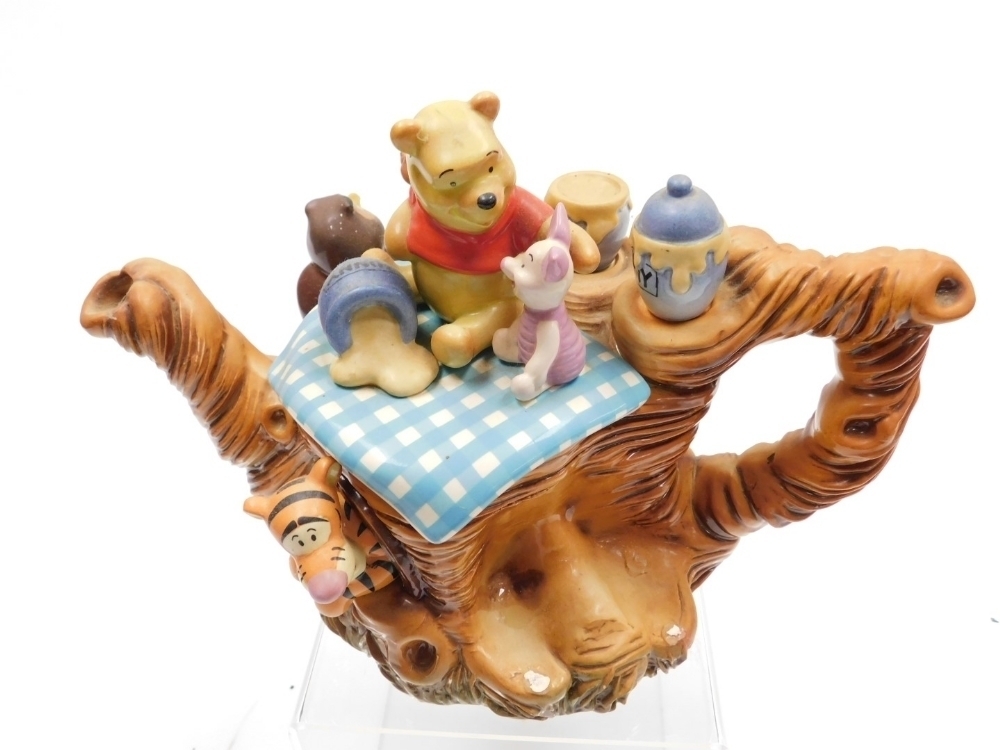 Three Disney pottery teapots, comprising Disney Showcase Collection ...