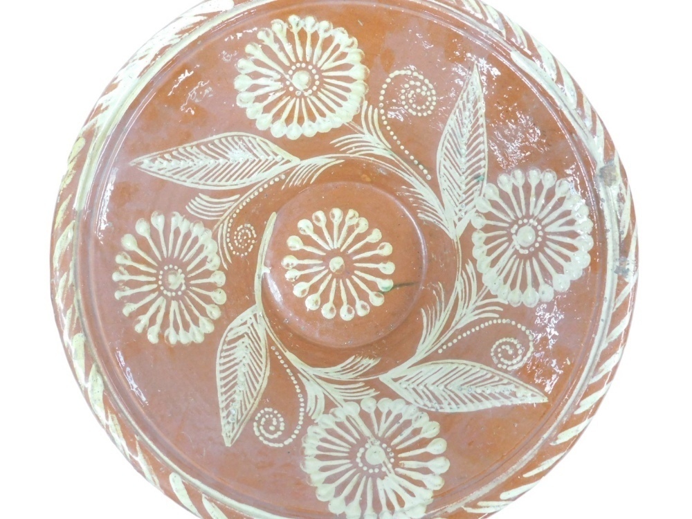 A late 19thC slip ware bowl, decorated with flowers and leaves, 38.5cm ...