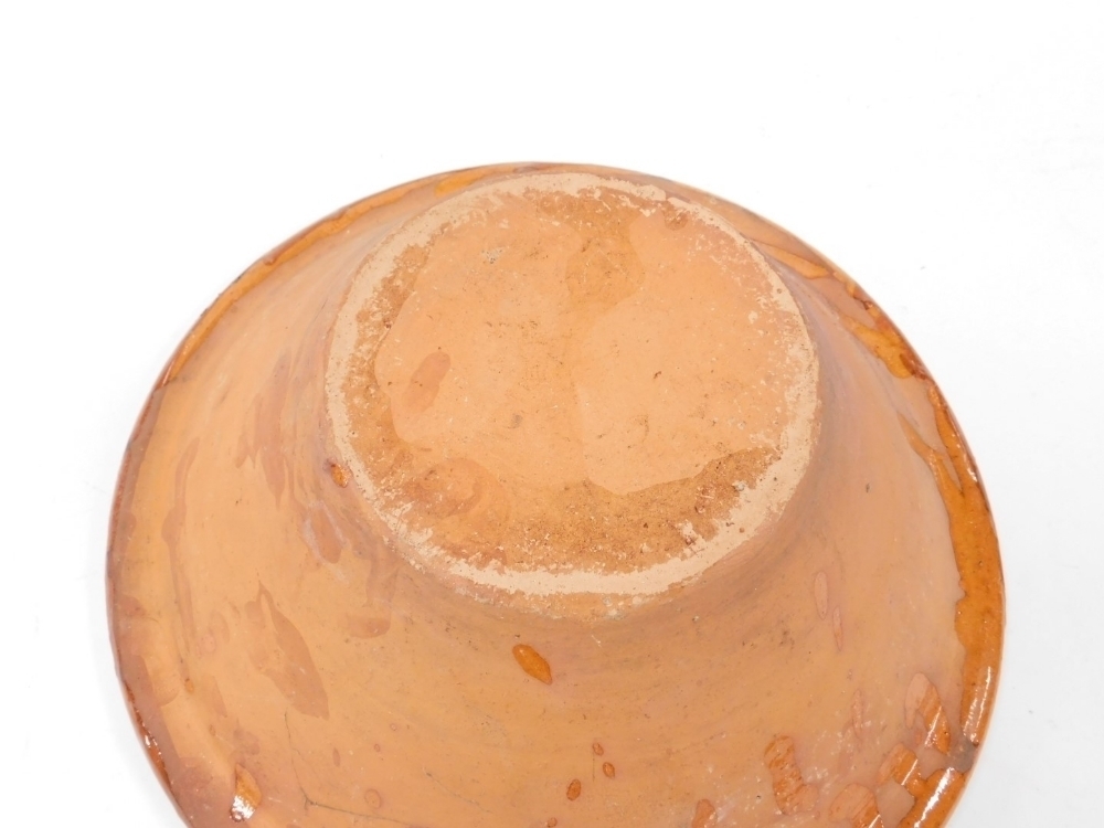 A late 19thC slip ware bowl, decorated with flowers and leaves, 38.5cm ...