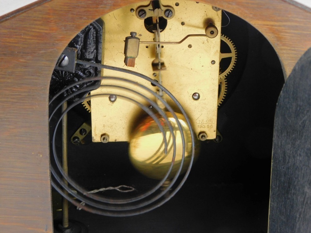 A 1950s Art Deco style walnut cased mantel clock, with a moulded case ...