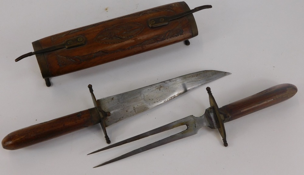 An Indian carving set, in a teak carved case, with fork and knife, in a ...