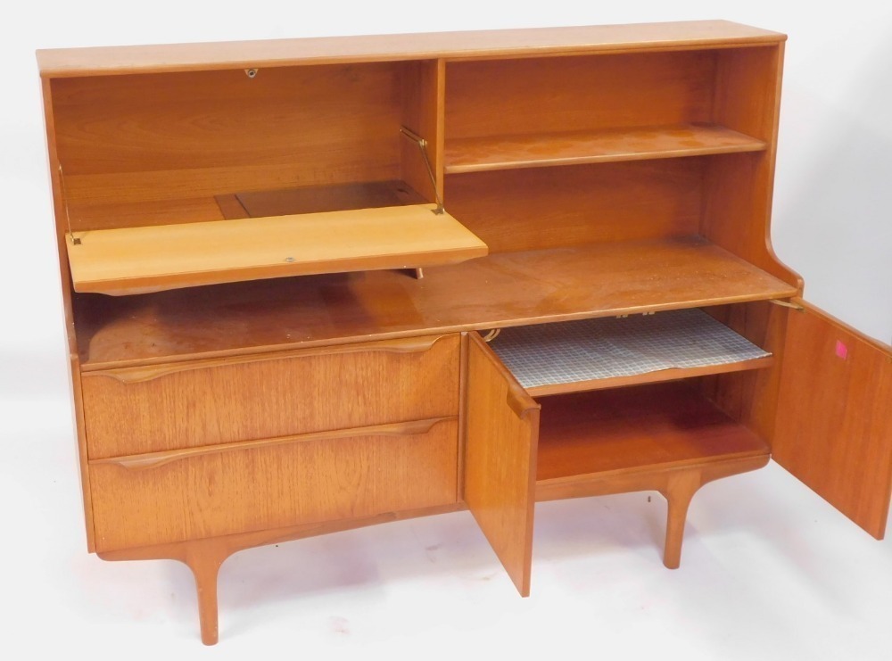 An S Form teak sideboard, the top with a drop down drinks cabinet ...