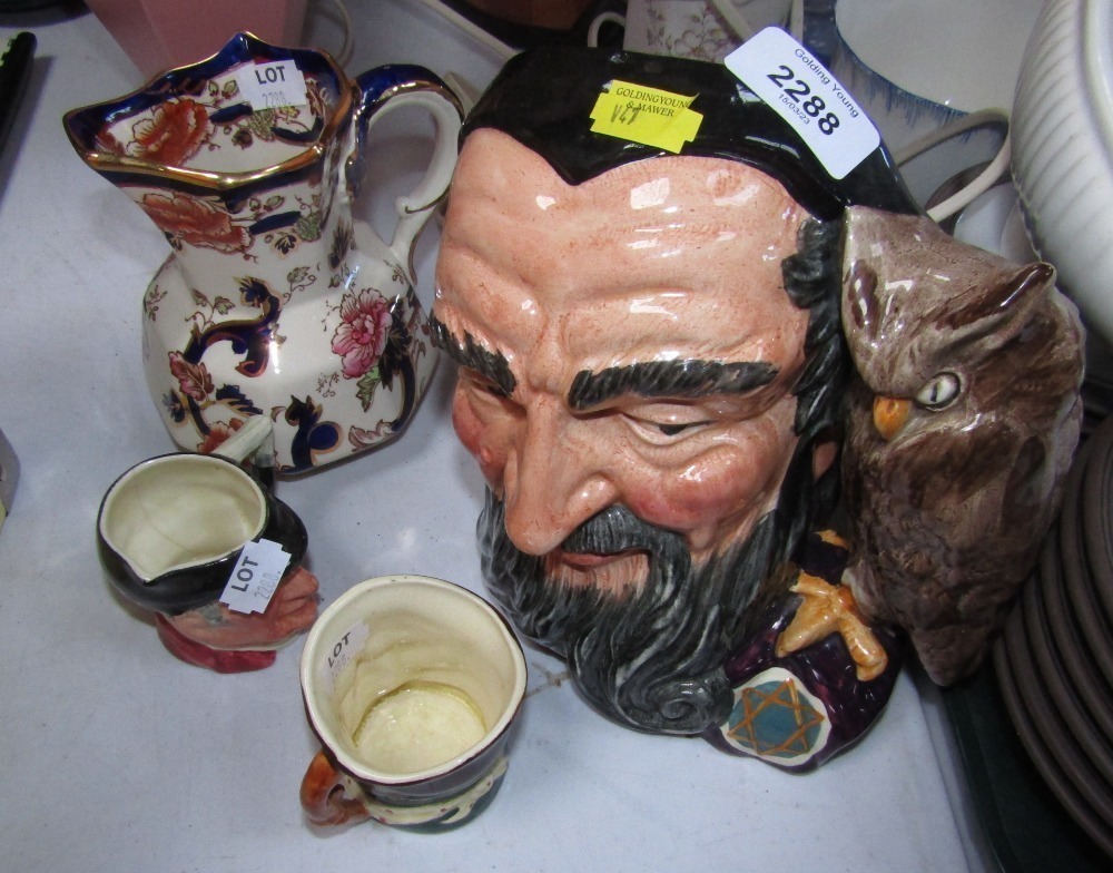A Royal Doulton Merlin large character jug, two Sandland ware miniature ...