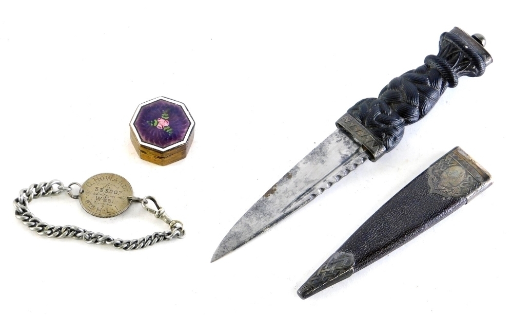 A Scottish dagger, with heavily carved turned handle, compressed pommel ...