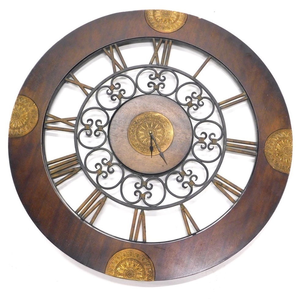 A modern wall clock, in hardwood frame, with pierced Roman numeric ...