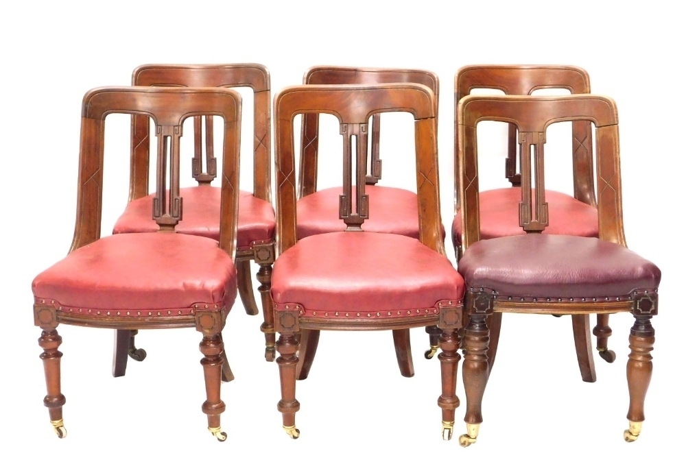 A set of four Victorian mahogany spoon back dining chairs, each with a ...