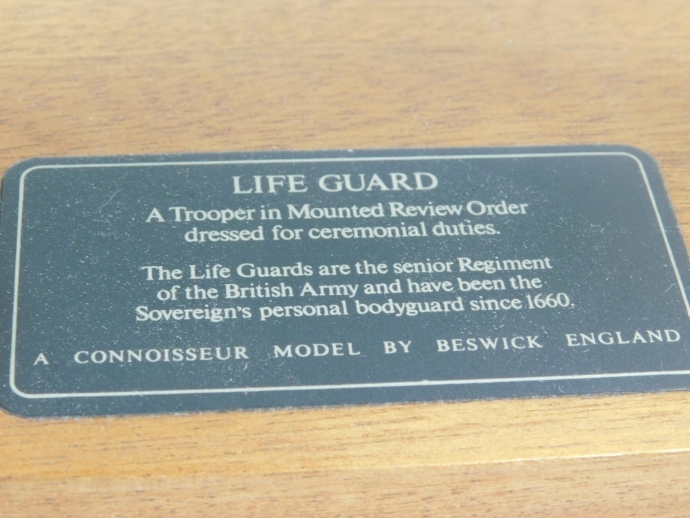 A Beswick Connoisseur model of Lifeguard, a trooper in mounted review ...
