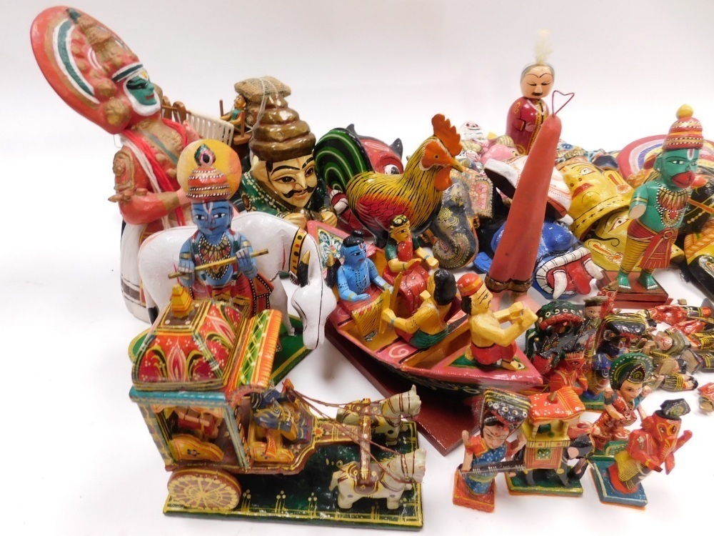 A group of Indian papier mache wall masks, to include depictions of ...