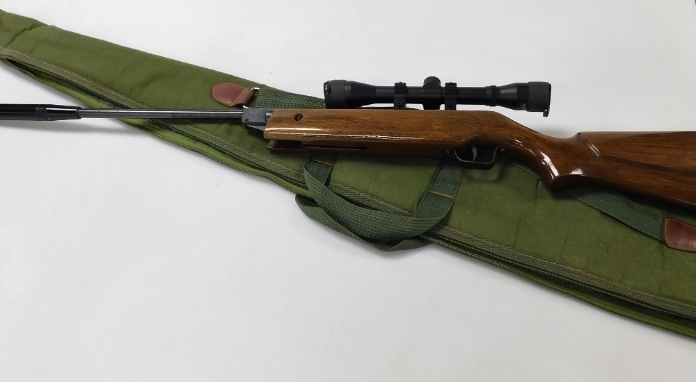 A BAM air rifle, XXB12 calibre, 5.5/22, with silencer and sight, cased.
