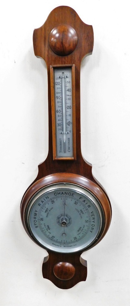 An early 20thC walnut cased aneroid barometer, with thermometer, 66.5cm ...