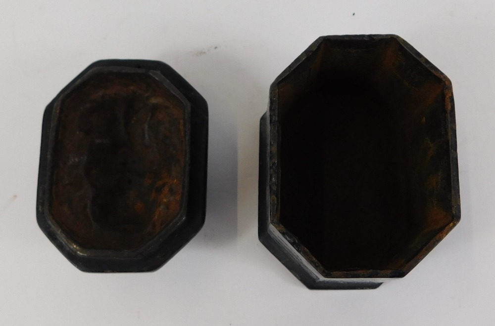 A Victorian cast iron tobacco box, of octagonal form, with an embossed ...