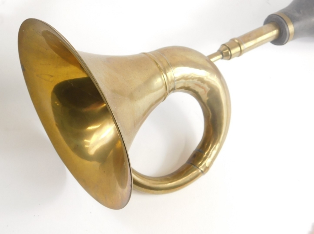 Two replica brass coach horns.