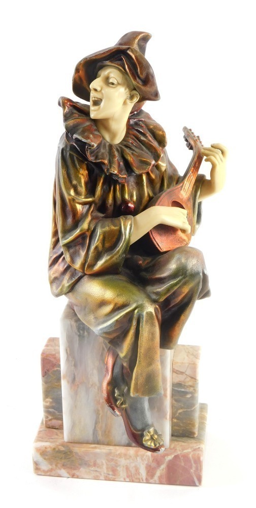 An Art Deco style gilt and copper patinated spelter figure of Pierrot ...
