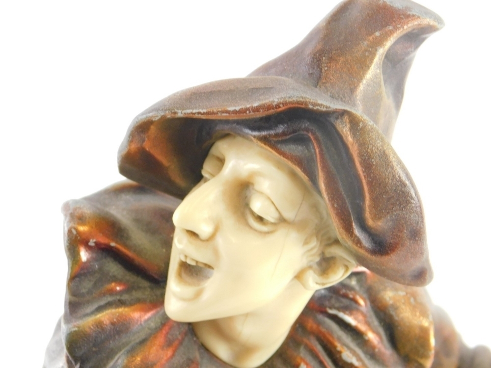 An Art Deco style gilt and copper patinated spelter figure of Pierrot ...