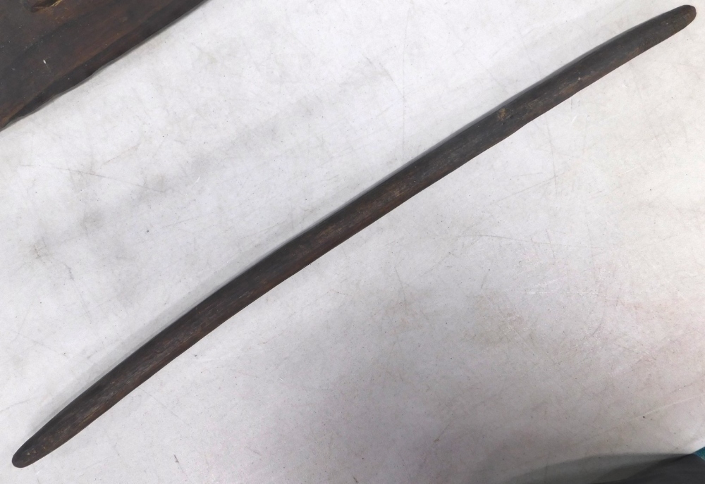 An Aboriginal shield, of plain ellipse form, with carved handle, 66cm x ...