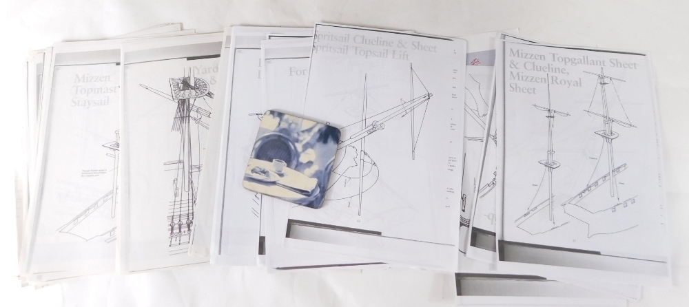 A scale model of a ship, with realistic rigging and deck, on stand ...