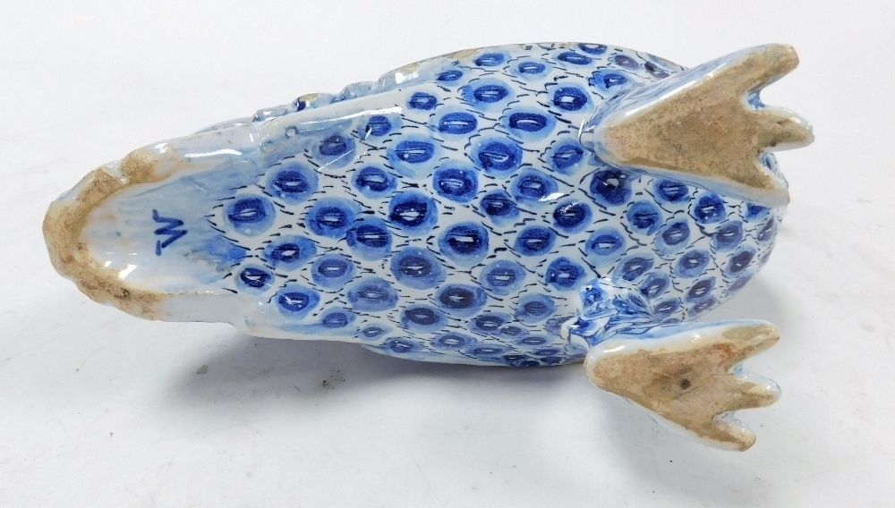 A 19thC Continental blue and white faience flagon modelled as a ...