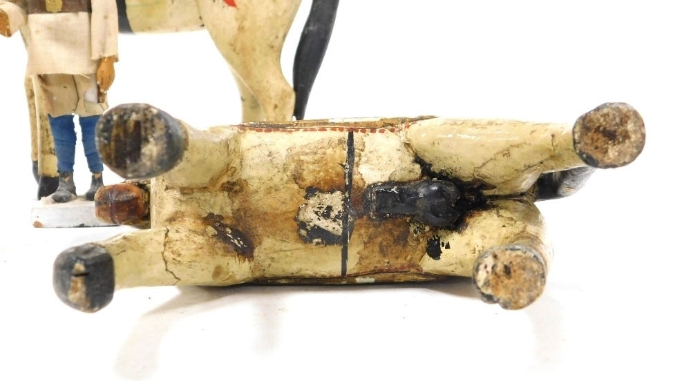 Three early 20thC Indian painted wooden carvings of horses, further ...