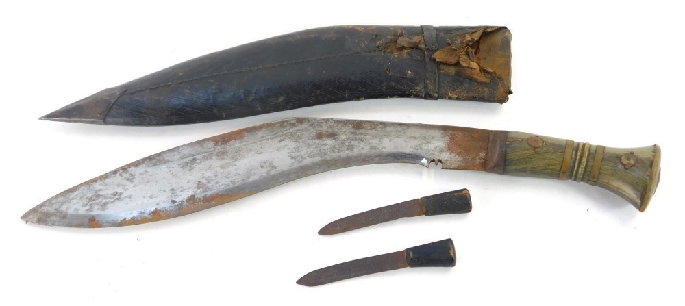 A horn handled kukri dagger, with brass inlay, with curved blade, in ...