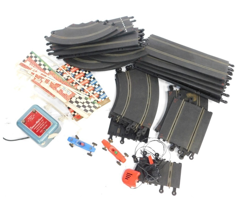 Scalextric, comprising track, bumpers, two cards, transformer pack, etc ...
