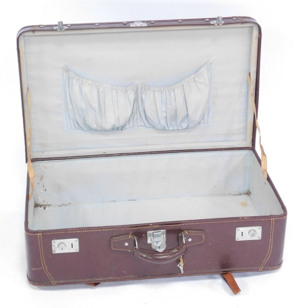 A vintage dark brown leather trunk, with a turquoise silk and lined ...
