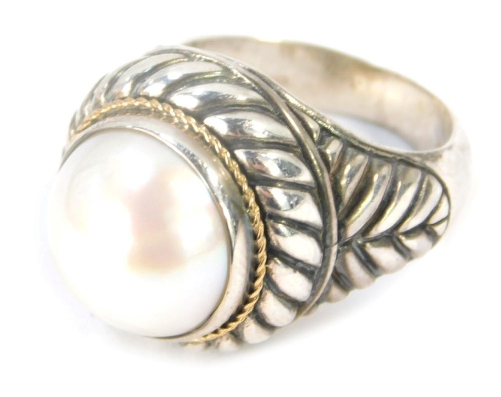 A Jonathan Lyme silver dress ring, set with single Mabe pearl, with ...
