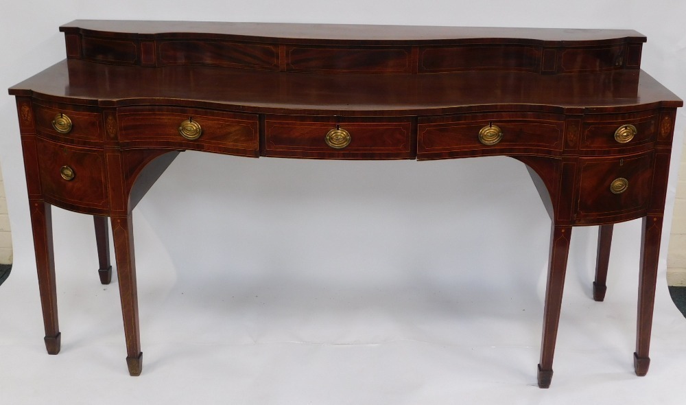 A 19thC flame mahogany serpentine sideboard, with raised top, three ...