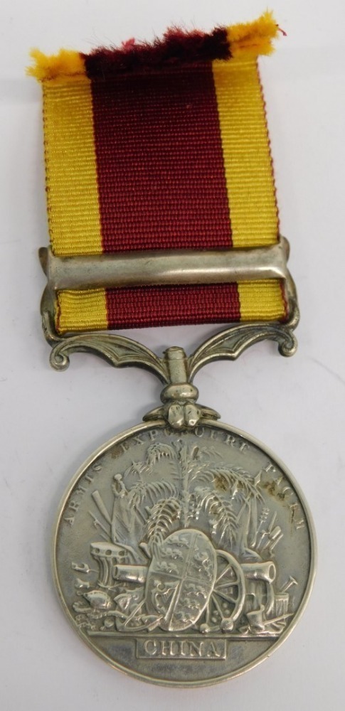 A medal, marked China, the ribbon with Pekin 1860 clasp, unmarked.