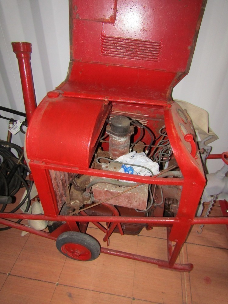 A vintage portable fire pump tender.