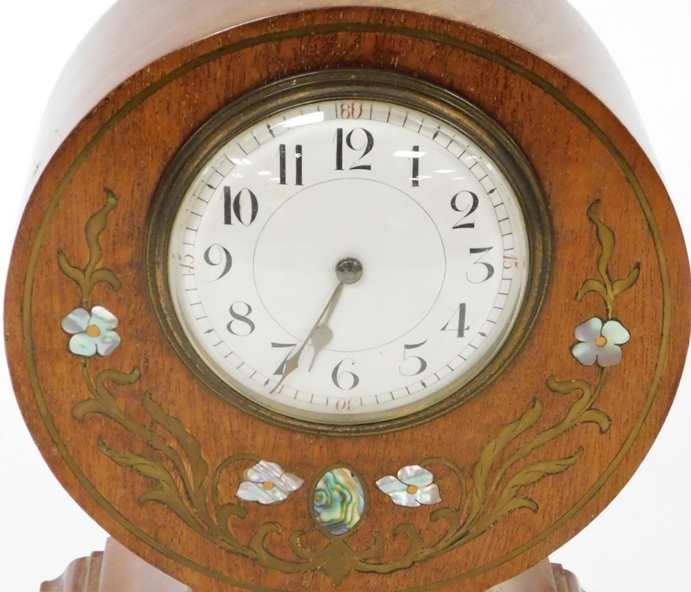 An early 20thC French mahogany balloon mantel clock, with brass and ...