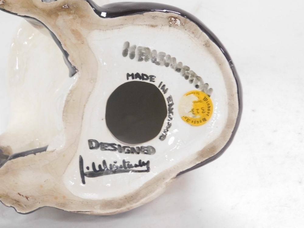 A Winstanley pottery figure of a Siamese cat, modelled in seated pose ...