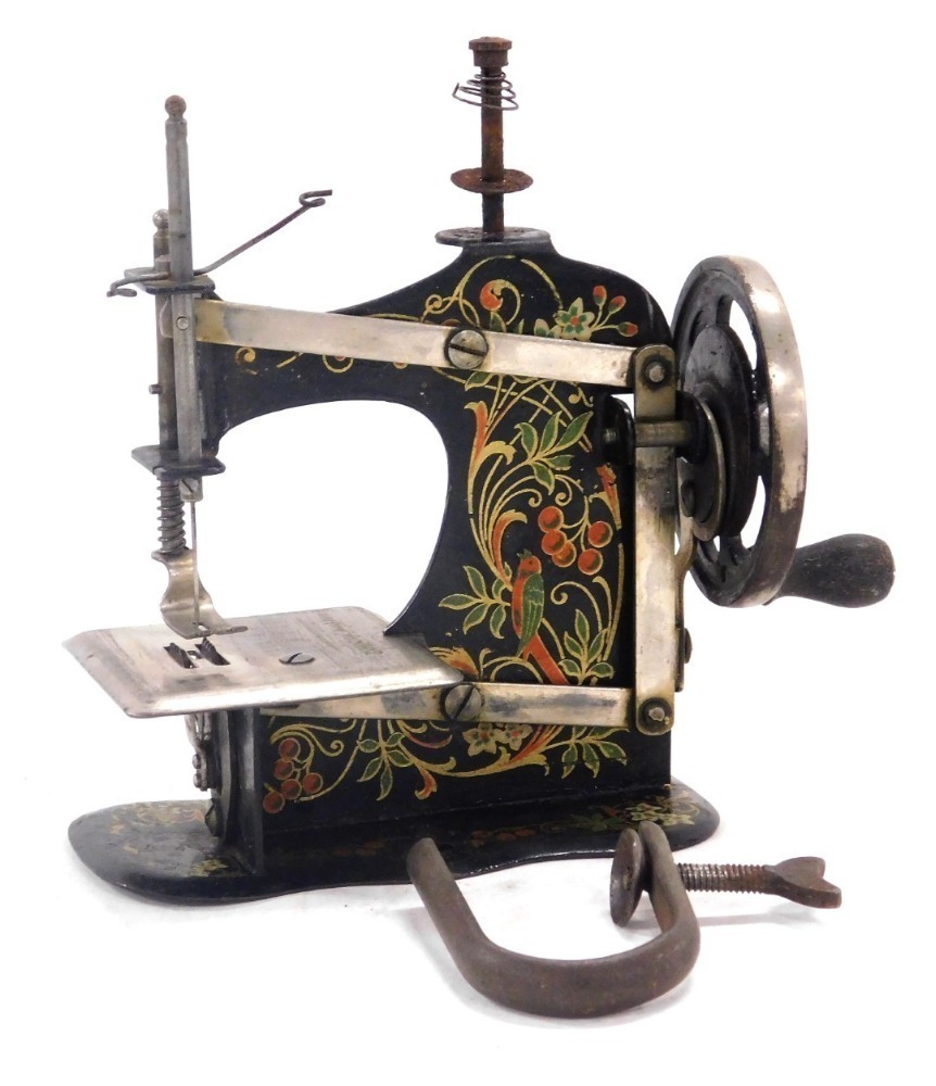 An early 20thC Muller child's toy sewing machine, model number 4, boxed ...