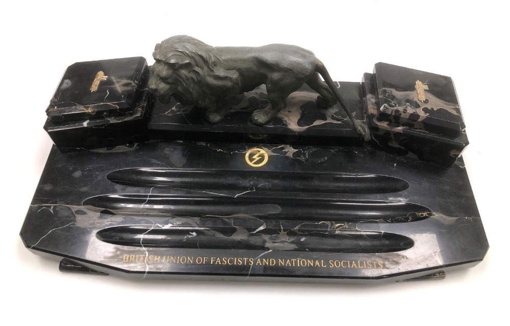 Political interest. A large variegated black marble desk stand with ...