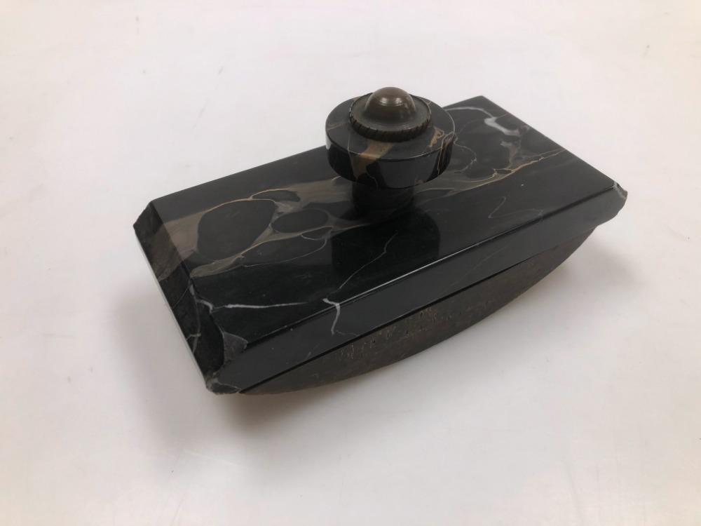 Political interest. A large variegated black marble desk stand with ...