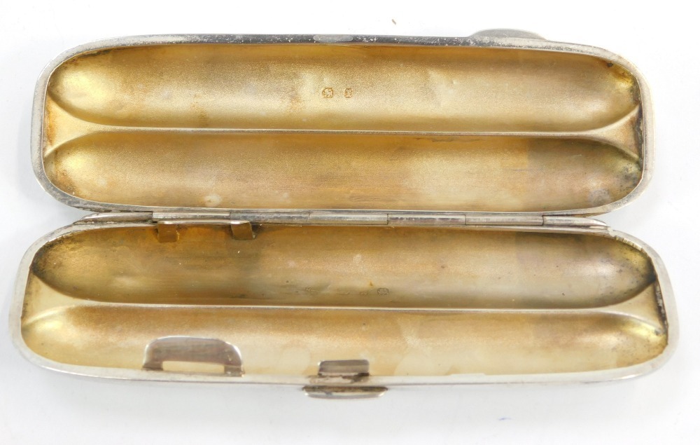 A Victorian silver cigar case, to enclose two cigars with scroll engine ...