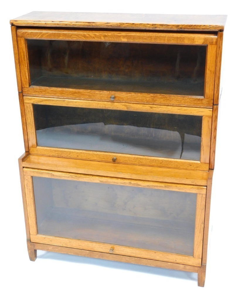 A Globe Wernicke style oak three section bookcase, with up and over ...