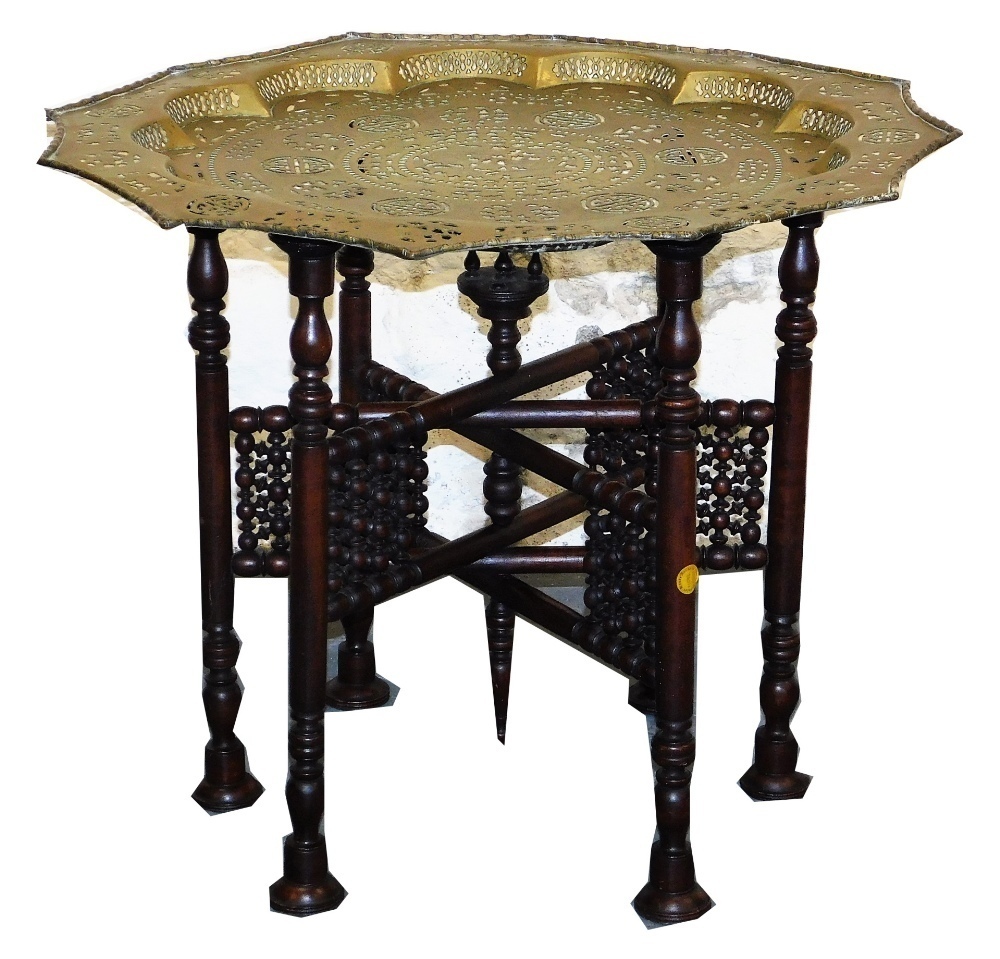 A Chinese pierced brass shaped tray top table, with hardwood folding ...