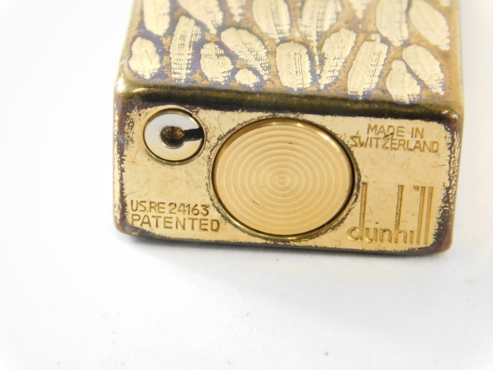 A 20thC Dunhill pocket lighter, with textured finish and yellow enamel ...